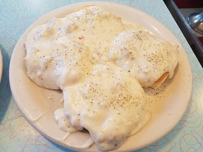 Biscuits and gravy—Southern comfort that migrated north and found a happy home. A plate that says "nap time" before you've finished.