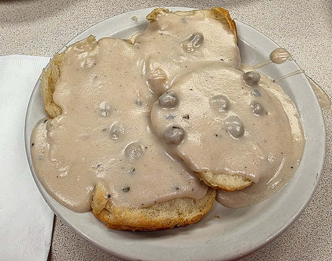 Biscuits and gravy that could settle family feuds. Creamy, peppery gravy cascading over fresh-baked biscuits—breakfast doesn't get more soul-satisfying than this.