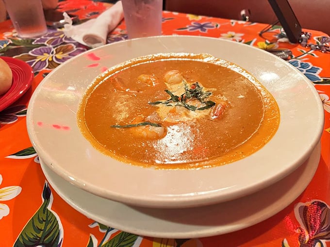 A bowl of seafood bisque that whispers tales of the Gulf, each spoonful a warm embrace from the ocean itself.