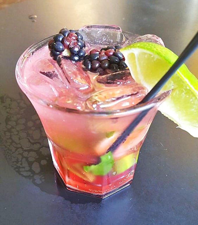 This blackberry mojito isn't just a drink—it's summer in a glass, with berries and mint playing like old friends at a backyard party.