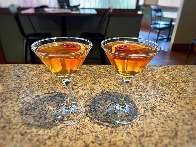 Cocktails that make waiting for your entrée a pleasure, not a chore. These amber Manhattans with their perfect cherry garnish are liquid patience in a glass.