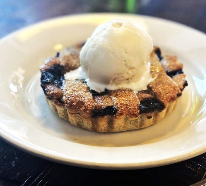 The berry pie arrives with ice cream slowly surrendering to the warm filling – a sweet finale that demands you loosen your belt.