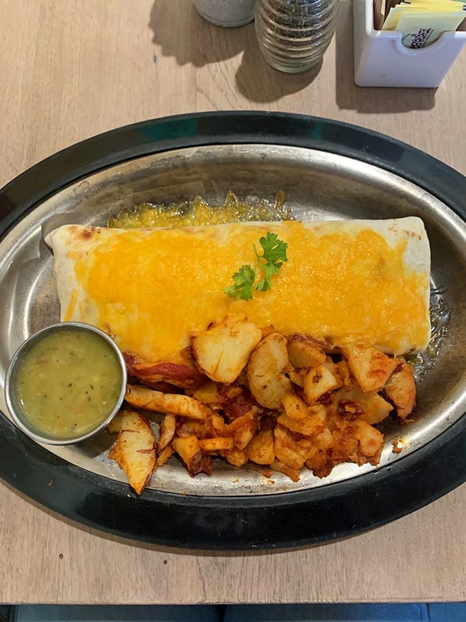 This breakfast burrito isn't just food—it's a warm, chile-smothered hug that makes you forget all your problems, at least until the last bite.