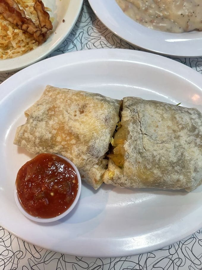 This breakfast burrito isn't just a meal, it's a commitment—stuffed with promise and served with a side of salsa salvation.