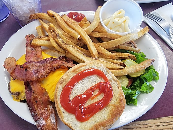 The classic American cheeseburger with bacon—proof that simplicity, when done right, needs no improvement. Those fries look hand-cut and heaven-sent.