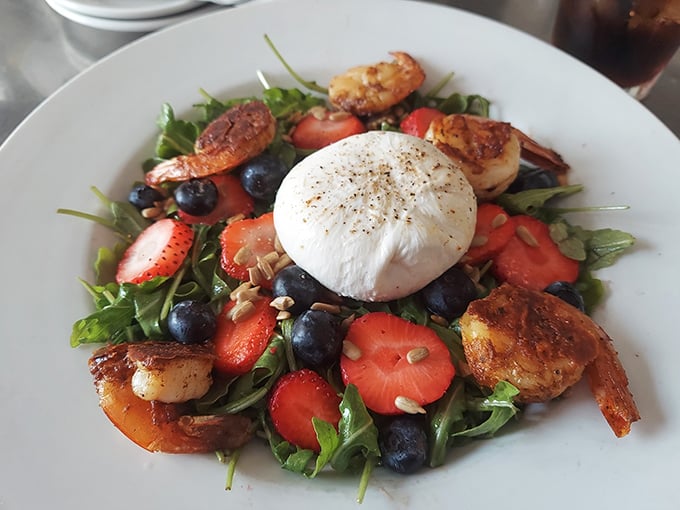 A burrata salad that's basically summer on a plate. That cloud of cheese in the center isn't just burrata—it's what dreams are made of.