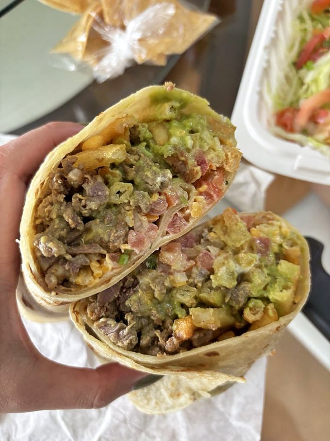 This California burrito cross-section reveals the beautiful stratification of flavors—like a delicious geological wonder you can eat.