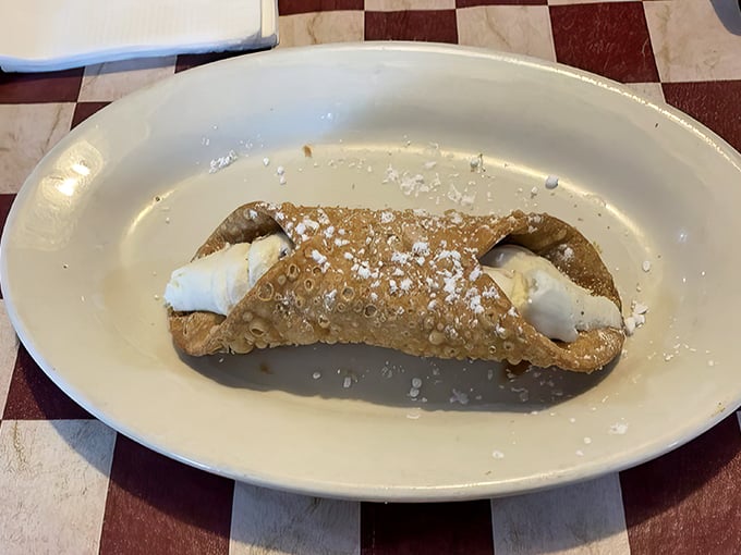 Not just dessert—a statement. This cannoli, with its crisp shell and creamy filling, is the perfect punctuation mark to end your tomato pie adventure.