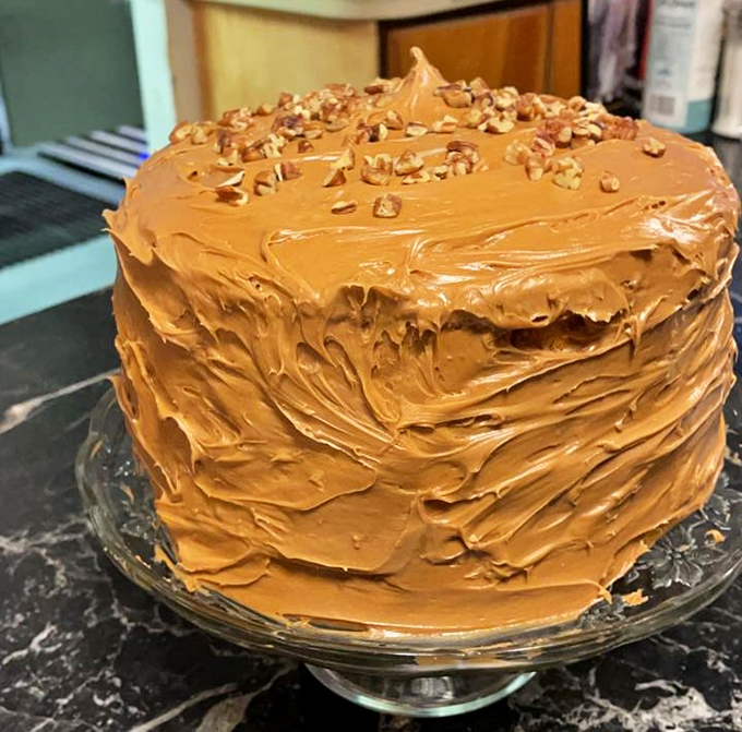 Not all heroes wear capes—some wear caramel frosting and pecans. This towering cake is what dessert dreams are made of.