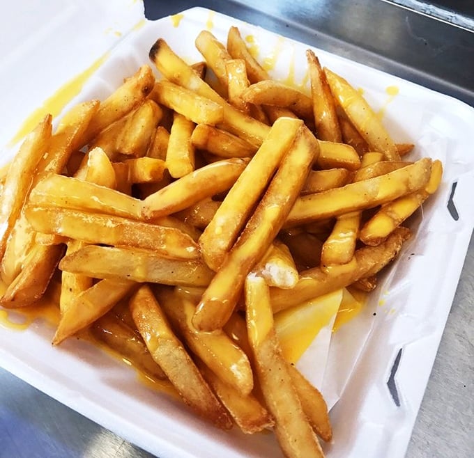 These aren't just fries—they're golden pillars of potato perfection that somehow make waiting for your sandwich an event rather than a chore.
