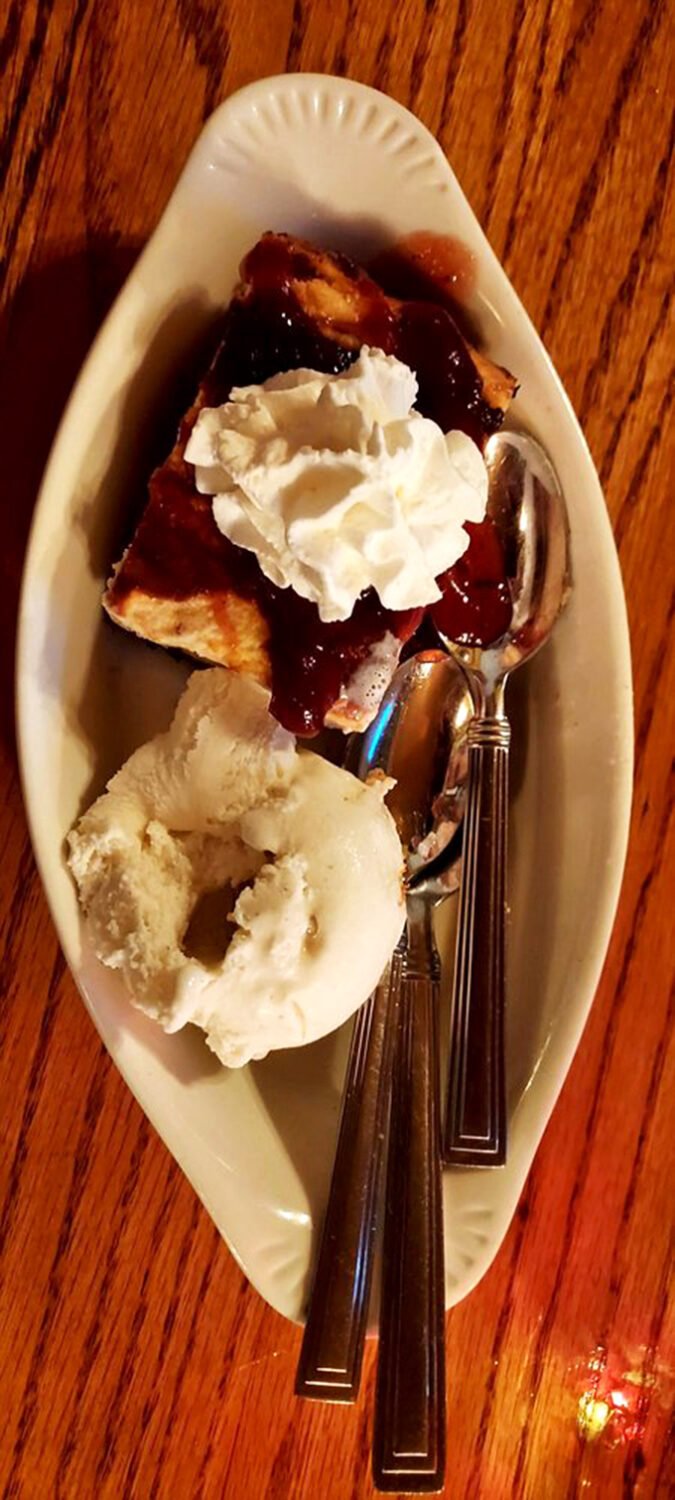 A sweet finale that proves Irish hospitality extends to dessert – warm bread pudding with berry compote and vanilla ice cream that melts into pure bliss.