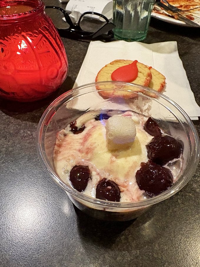Ice cream and cherries jubilee—proof that sometimes the simplest desserts are the most satisfying, especially when served with a cookie chaser.
