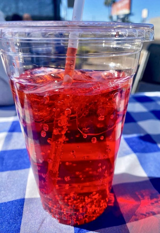 Even the cherry soda feels special here—a ruby-red companion that cuts through the richness of your meal perfectly.