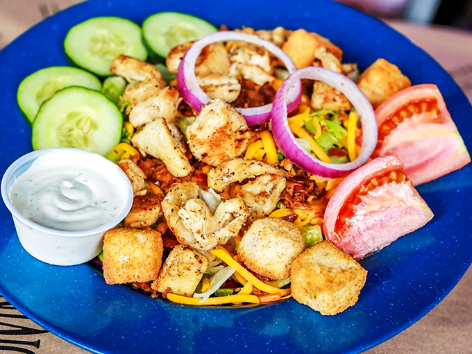 A salad that doesn't apologize for being healthy – it's too busy showing off grilled chicken, fresh veggies, and colors that pop like a coastal sunset.