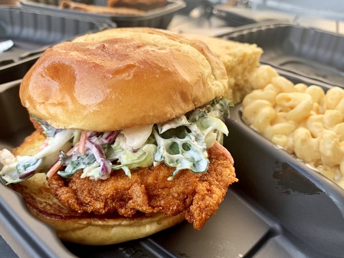 Not just a sandwich, but a masterpiece of engineering—crispy chicken, creamy slaw, and a soft bun creating the holy trinity of handheld happiness.