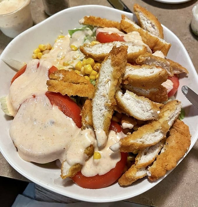 Not just a salad—a celebration with crispy chicken and creamy dressing. Even the vegetables seem happier here.