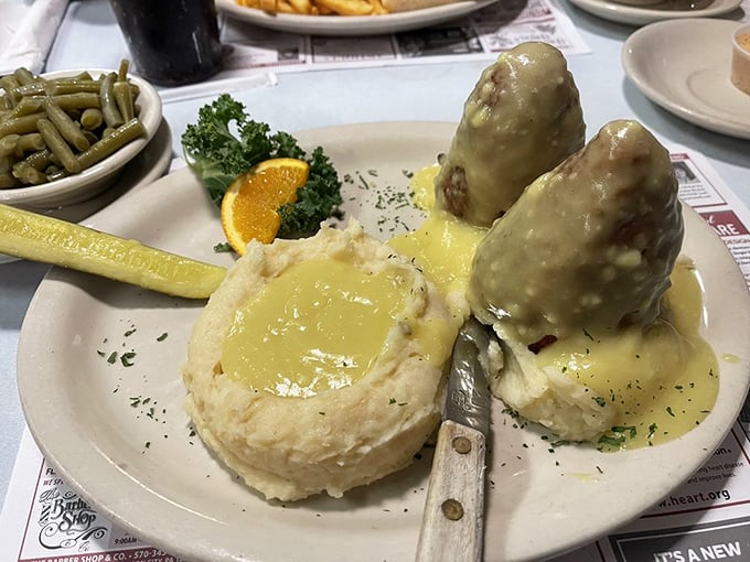 Chicken croquettes swimming in gravy with mashed potatoes – comfort food so nostalgic it should come with a permission slip to nap afterward.