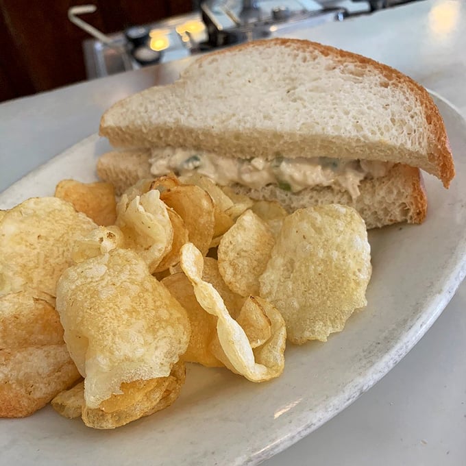 Chicken salad sandwich simplicity that proves sometimes the classics don't need remixing—just quality ingredients and potato chips for that perfect crunch counterpoint.