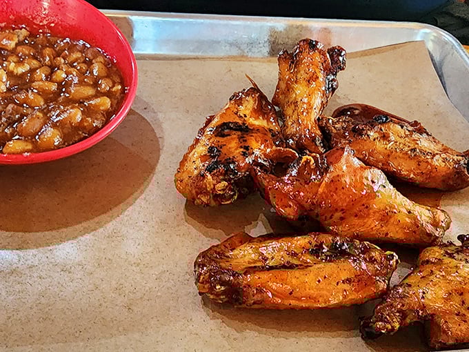 Chicken wings that look like they've been kissed by smoke and fire, with baked beans that could make a vegetarian reconsider their life choices.