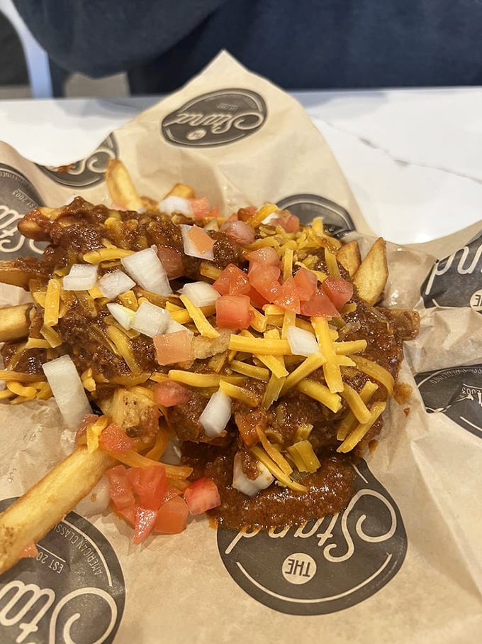 Chili cheese fries that laugh in the face of diet culture—a glorious mess of comfort that demands to be shared but rarely is.