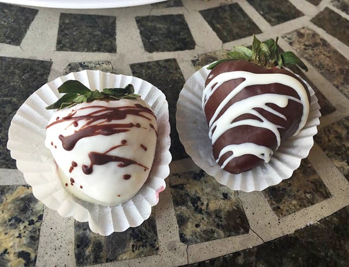 Chocolate-dipped strawberries dressed in their formal white and dark chocolate tuxedos—fruit that's clearly been to finishing school.