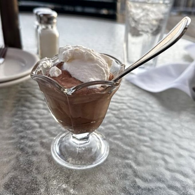 Chocolate mousse crowned with whipped cream—the perfect sweet ending after all that virtuous seafood eating.
