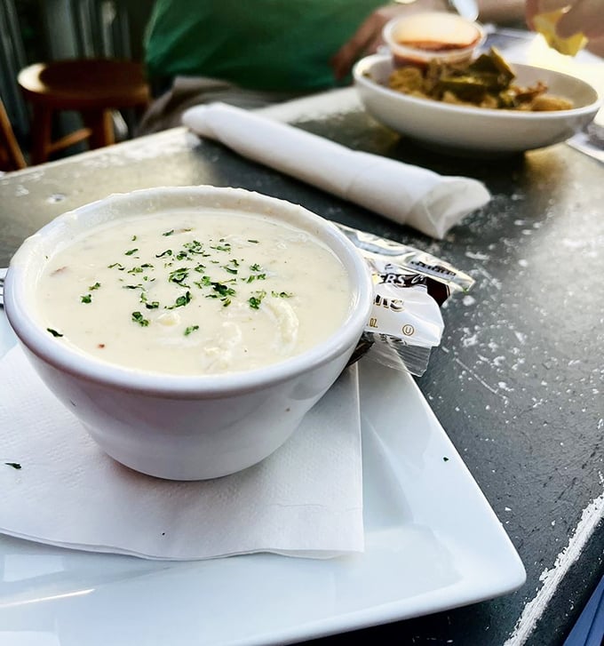 A bowl of proper New England clam chowder – creamy but not gluey, loaded with clams, and topped with fresh herbs. Winter in a bowl.