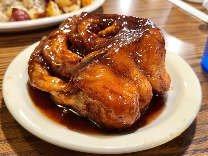 This cinnamon roll isn't just breakfast—it's an event. Swimming in sweet glaze and big enough to have its own zip code.