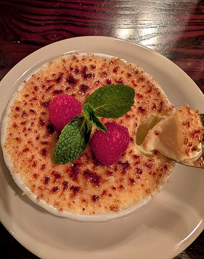 The crème brûlée arrives with a perfectly caramelized top—that satisfying crack when your spoon breaks through is nature's perfect sound.