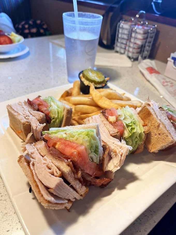 This club sandwich isn't playing around—it's a skyscraper of flavor that makes you wonder why you ever settled for lesser sandwiches.