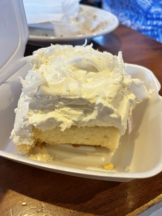 A slice of coconut cream cake that would make your grandmother both proud and jealous. Cloud-like frosting that's worth every calorie.