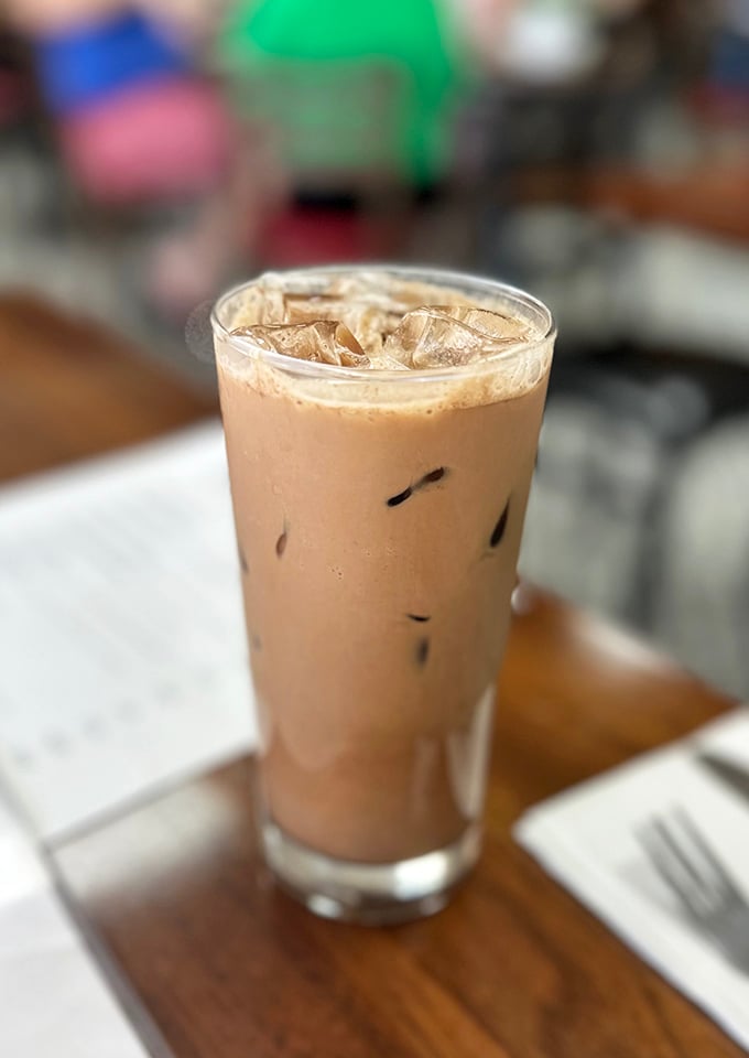 The iced coffee stands ready for duty—the faithful companion to your pastry adventure, like Robin to your Batman of breakfast choices.