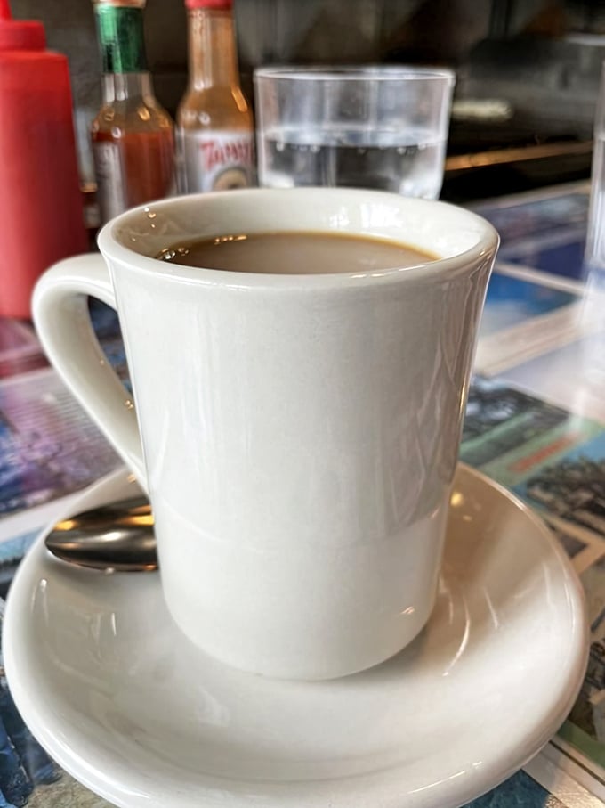 Simple pleasures in white ceramic. This isn't fancy third-wave coffee with tasting notes—it's the honest cup that keeps conversation and breakfast flowing.