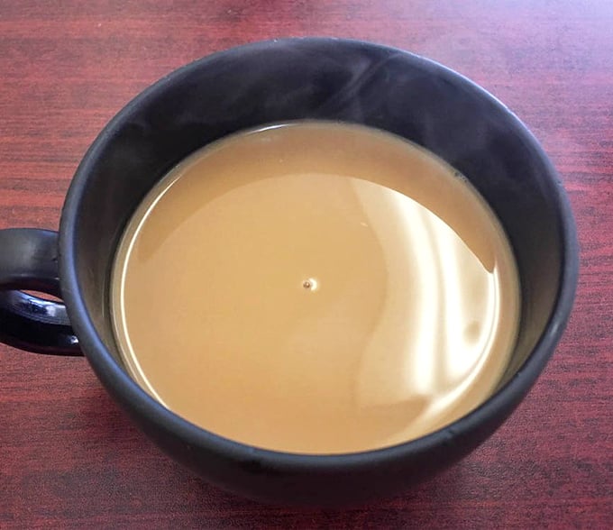 A simple cup of coffee that reminds us some pleasures need no embellishment – just a steady hand pouring and a moment to appreciate life's pause button.