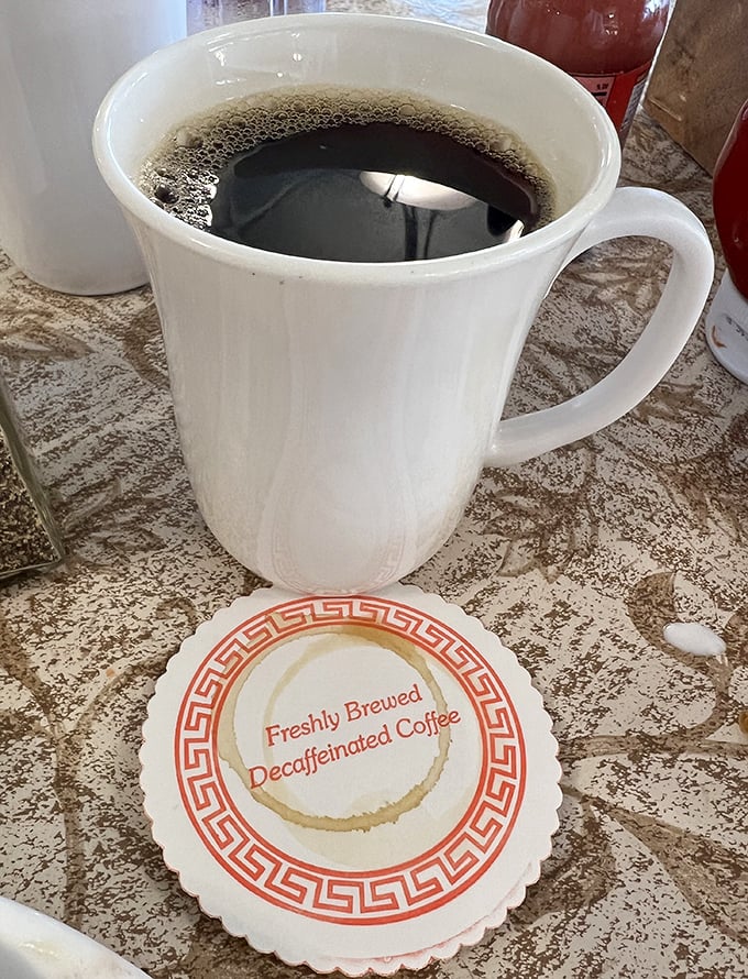 Even the coffee gets special treatment here, served with a coaster that reminds you this isn't some rushed caffeine fix – it's part of the experience.