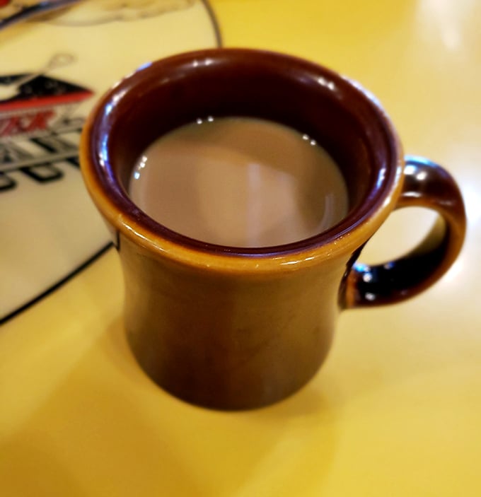 That sturdy mug isn't just holding coffee—it's cradling liquid motivation in a vessel that's survived decades of refills and revelations. Diner coffee: the original energy drink.