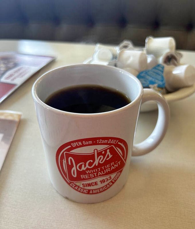 Coffee served in a mug that means business. No artisanal pour-overs here—just honest caffeine that fuels conversations and cures morning grumpiness.