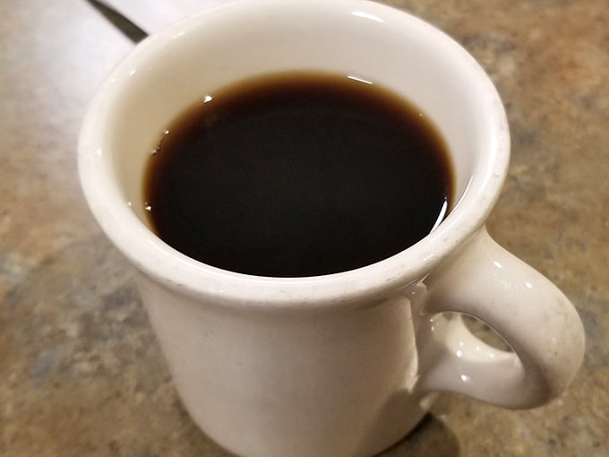 Simple, honest coffee in a classic mug—no fancy names, no pretension, just the fuel you actually need.