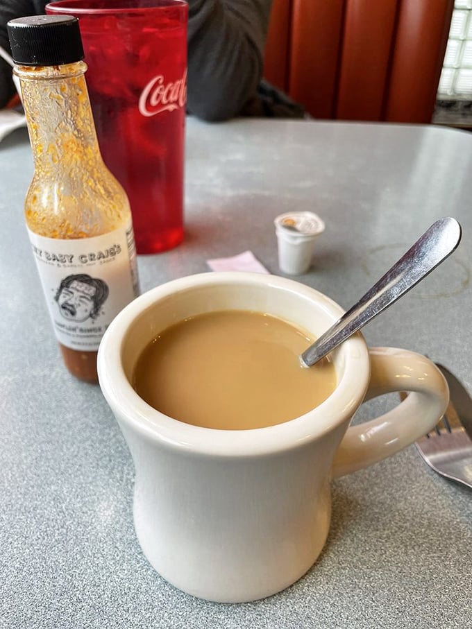 The classic white diner mug—holding what might be the most honest cup of coffee in St. Paul. No pretension, just caffeine.