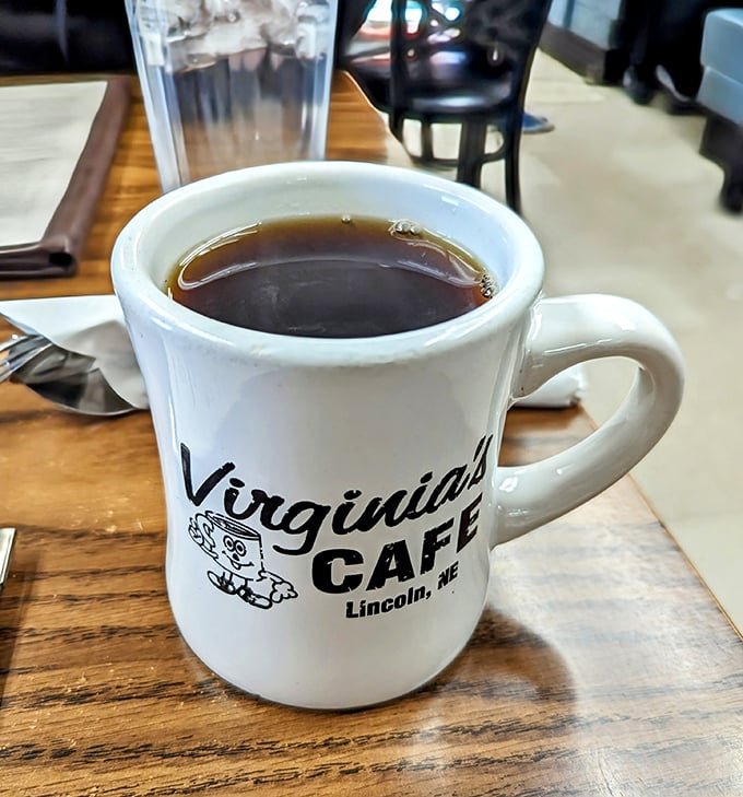 That Virginia's mug isn't just holding coffee—it's holding liquid optimism for the day ahead. The unofficial state beverage of morning people.