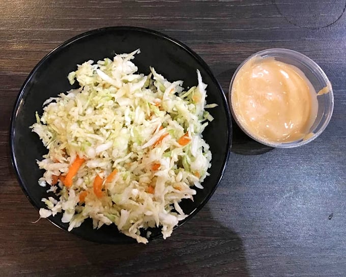 Fresh coleslaw with a side of house sauce—the supporting actors that deserve their own standing ovation in this Southern food drama.