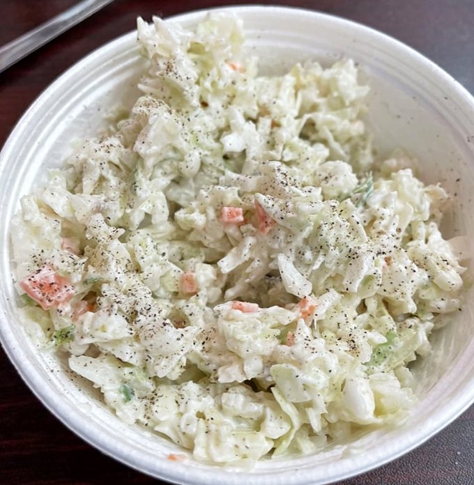 That coleslaw isn't just a side dish – it's the crisp, tangy referee your fried fish needs.