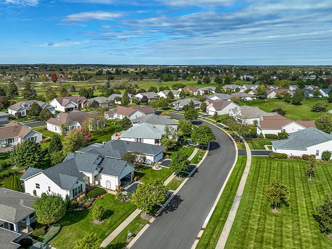 Birds-eye bliss! This aerial shot reveals the thoughtful community planning that creates neighborhoods where people actually know their neighbors—a concept almost as refreshing as the Illinois breeze.