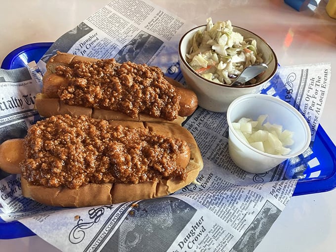 Coney dogs served on newspaper—journalism you can actually sink your teeth into. The coleslaw provides a crisp editorial perspective.