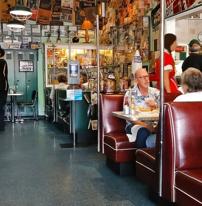 The booths aren't just seating; they're front-row tickets to the greatest show on earth – people enjoying real food in a place where calories don't count.