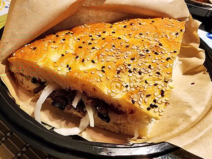 This sandwich doesn't just satisfy hunger—it abolishes it. Sesame-studded bread housing savory fillings that would make any deli proud.