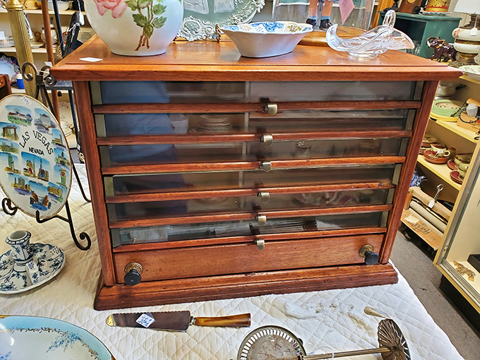This isn't just a drawer cabinet—it's a time capsule with handles. Craftsmen from another era built this beauty to outlast trends and technology.