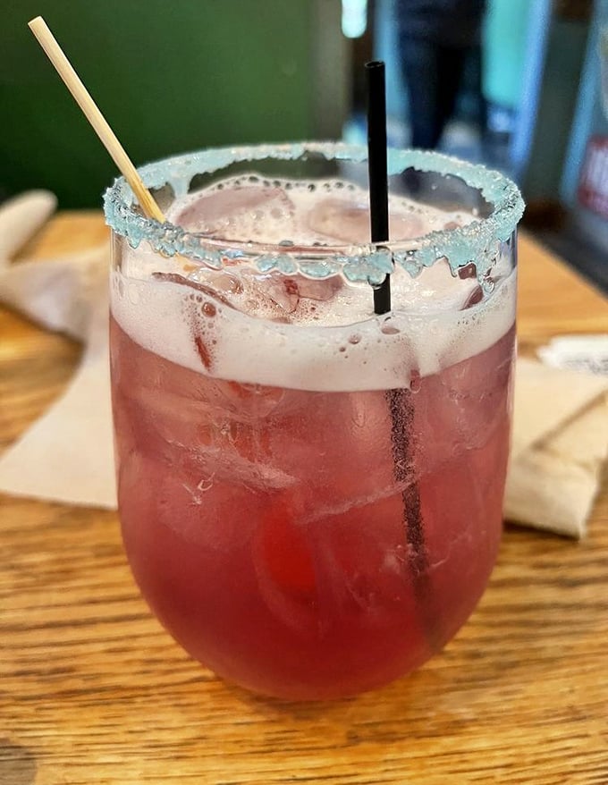 This isn't just a cocktail—it's a vacation in a glass. The blue-rimmed sugar crust adds both sparkle and sass to your brunch experience.