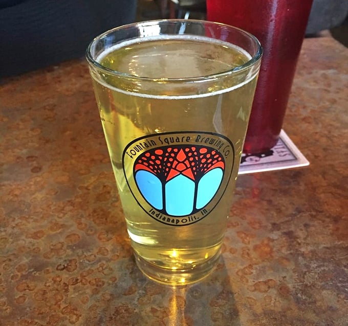 Local craft beer in a Fountain Square glass—the perfect companion for Fat Dan's smoky offerings. Liquid gold meets meat magic.