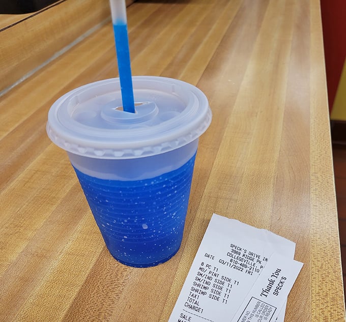 Even the drinks at Speck's come with a side of nostalgia – that vibrant blue slushie is the exact color of summer vacation memories.